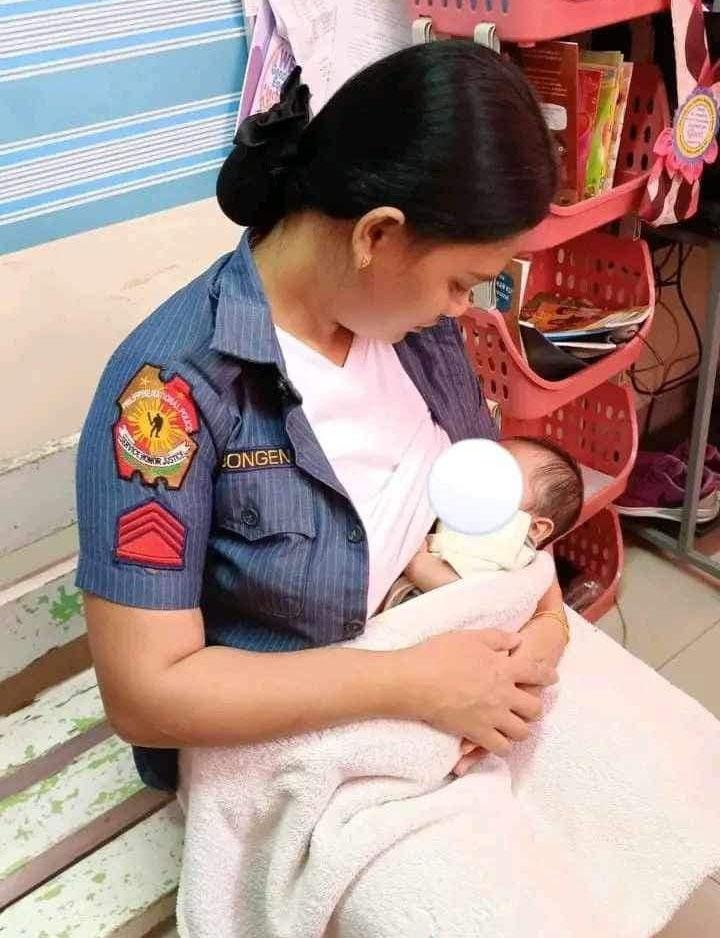 Young police officer shares breastmilk to a hungry baby